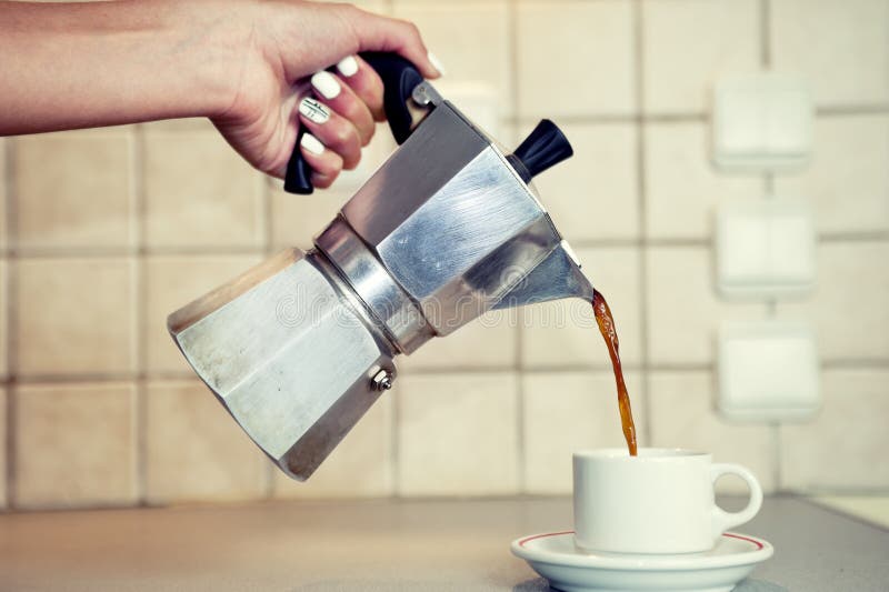 Hand Close Up Pouring Espresso Coffee in a Cup Stock Photo - Image of ...