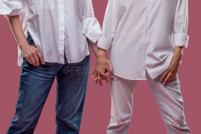 Close Up of Two Women Standing Hand in Hand Stock Photo - Image of ...