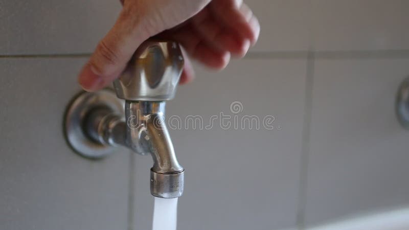 Hand Closing the Water Tap in the Sink To Avoid Waste Stock Footage ...