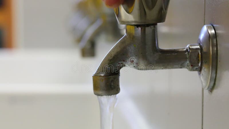 Hand Closing the Water Tap in the Sink To Avoid Waste Stock Footage ...