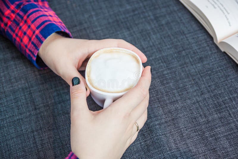 Hand and coffee stock photo. Image of person, book, beverage - 104702298