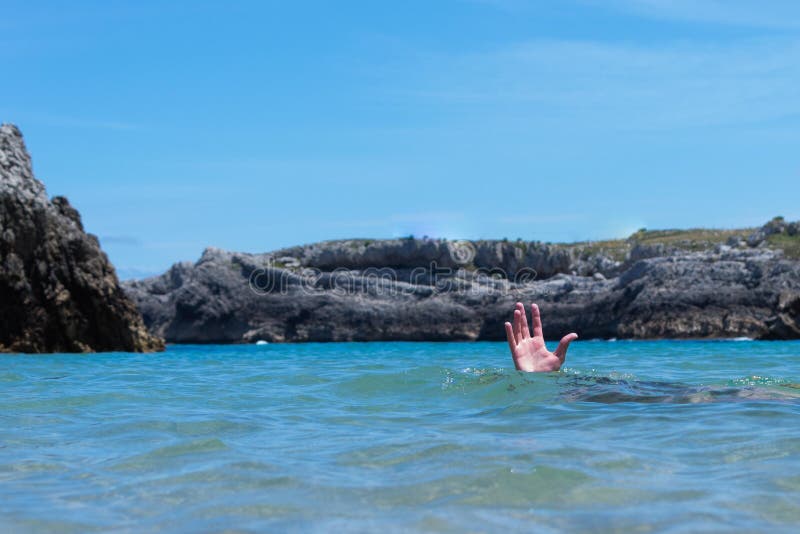 Hand Coming Out of the Water in the Middle of the Ocean Stock Image ...