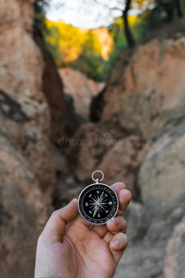 Compass in the mountains stock photo. Image of destination - 139277866