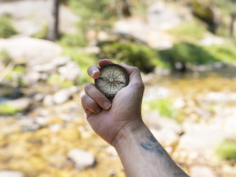 Hand with a Compass in the River Stock Photo - Image of caucasian ...