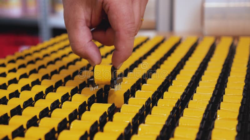 Hand Completing an Array of Electronic Components - Close Up Stock ...