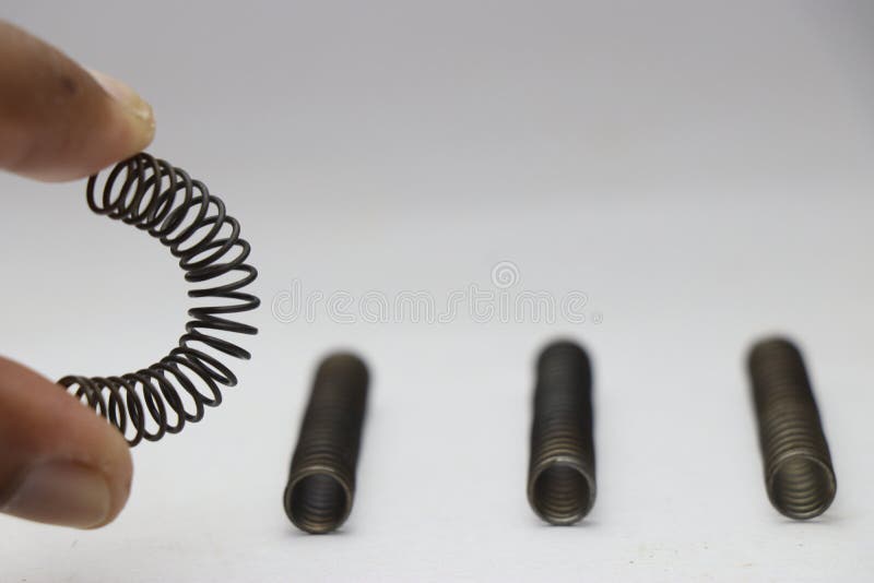 Compression Springs Made of Metal Holding in Hand, Metal Springs are ...