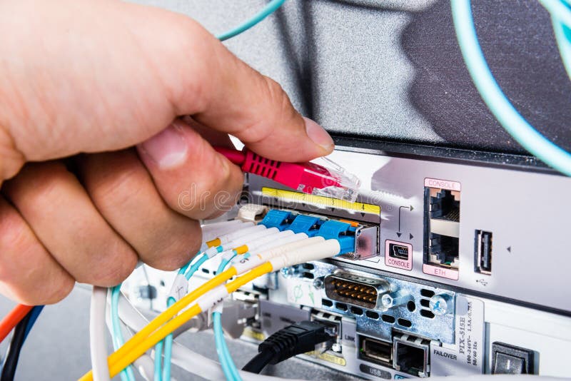 Hand of Computer Engineer Connecting Network Cable in Server Cab Stock ...