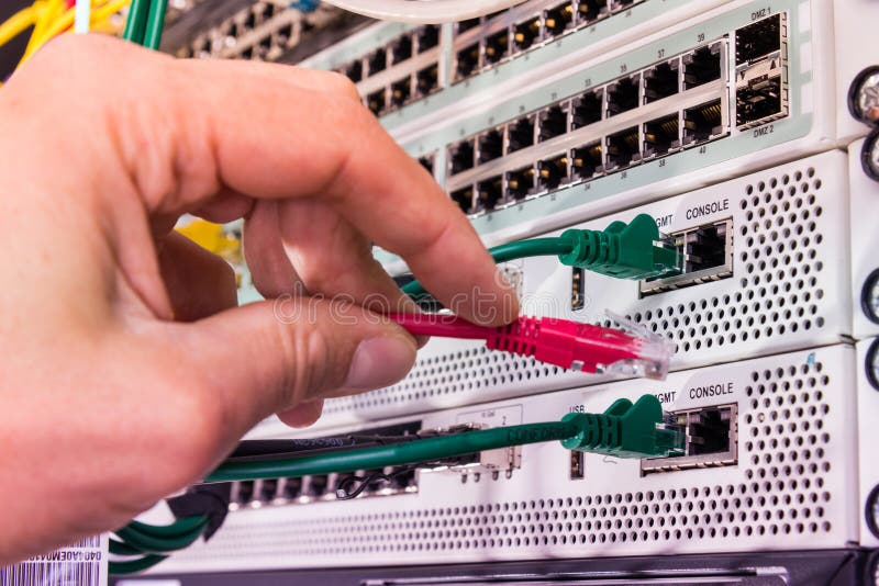 Hand of Computer Engineer Connecting Network Cable in Server Cab Stock ...