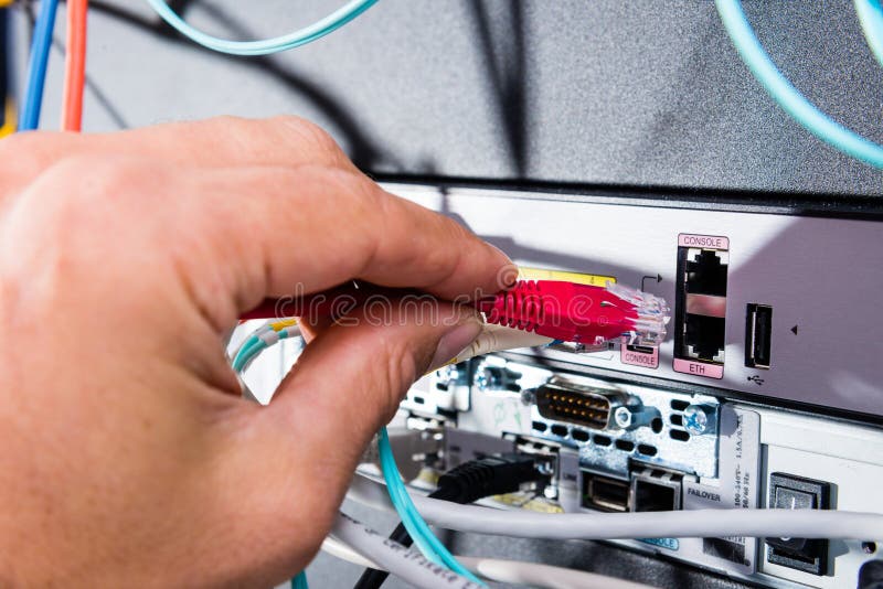 Hand of Computer Engineer Connecting Network Cable in Server Cab Stock ...