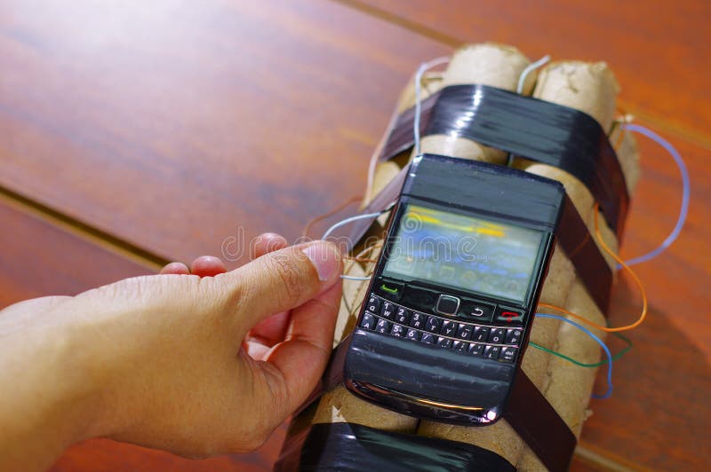 Hand Connecting the Cable of the Explosives To the Cellphone Stock ...