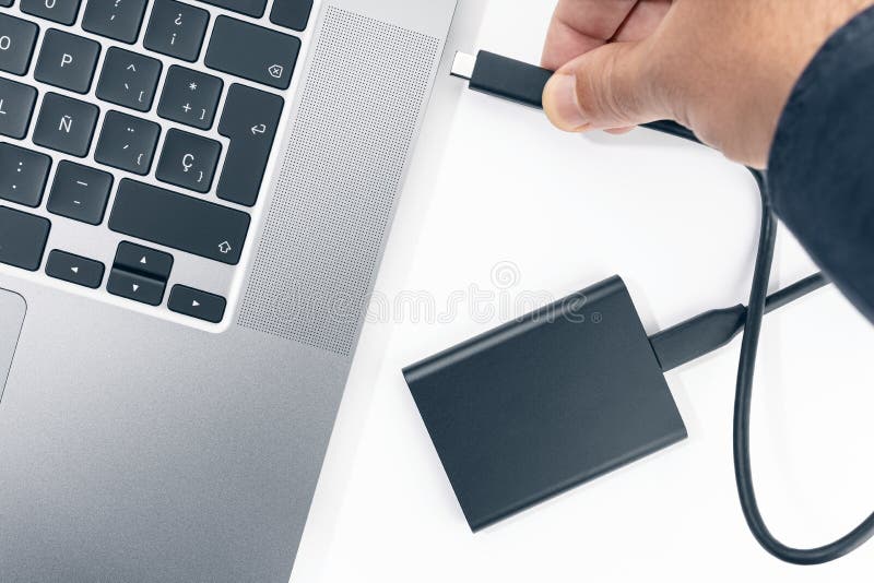 Hand Connecting a External Hard Disk To a Modern Laptop Computer Stock ...