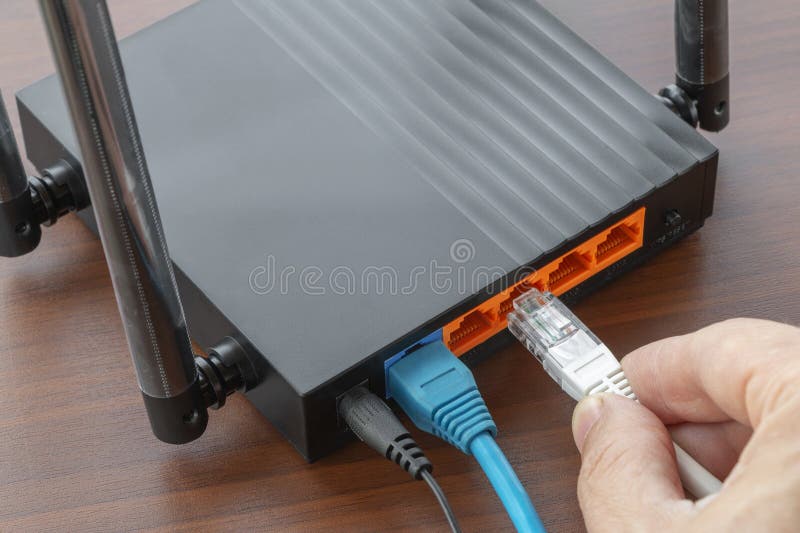 Hand Connects the Internet Cable To the Router S Socket, Stock Image ...