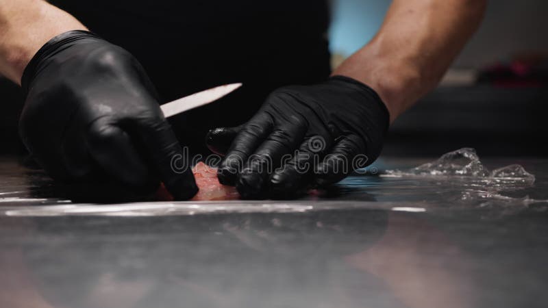 Hand of Cook is Using Biodegradable Cling Film for Fish Food Stock ...