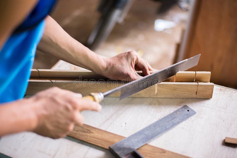 The Hand of a Craftsman is Working with a Dangerous Tool Stock Photo ...