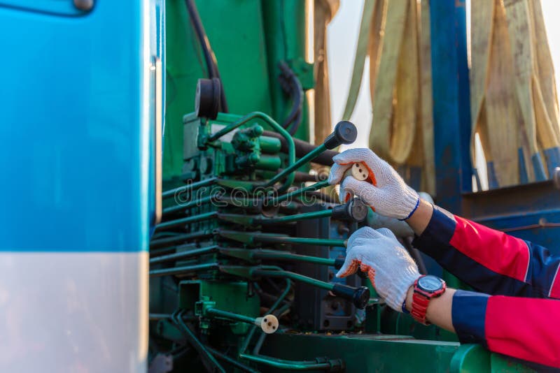 Hand of a Crane Operator Holding a Crane at a Construction Site Stock ...