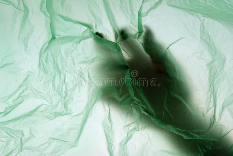 Hand and Plastic Bag. Hand Crumpling Package. Plastic Bag Concept ...