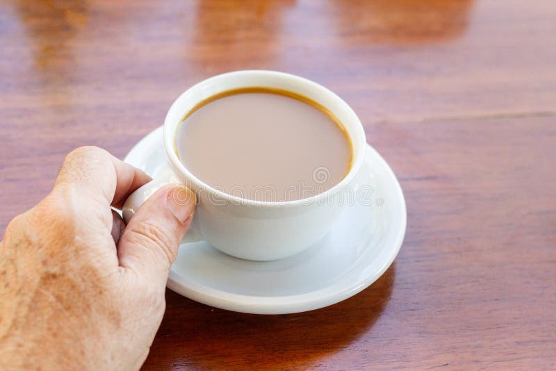 Hand with cup of coffee stock image. Image of delicious - 174246951