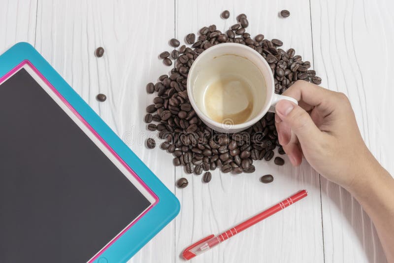 Hand with Cup of Coffee and Tablet on White Table Stock Photo - Image ...