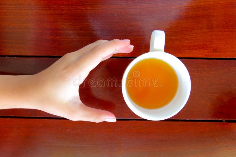 Hand with Cup of Tea on Wood Table,top View Stock Photo - Image of ...
