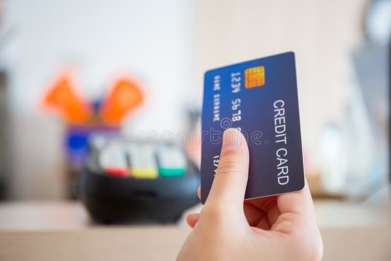 Hand of Customer with Credit Card Blurred Credit Card Reader Machine at ...