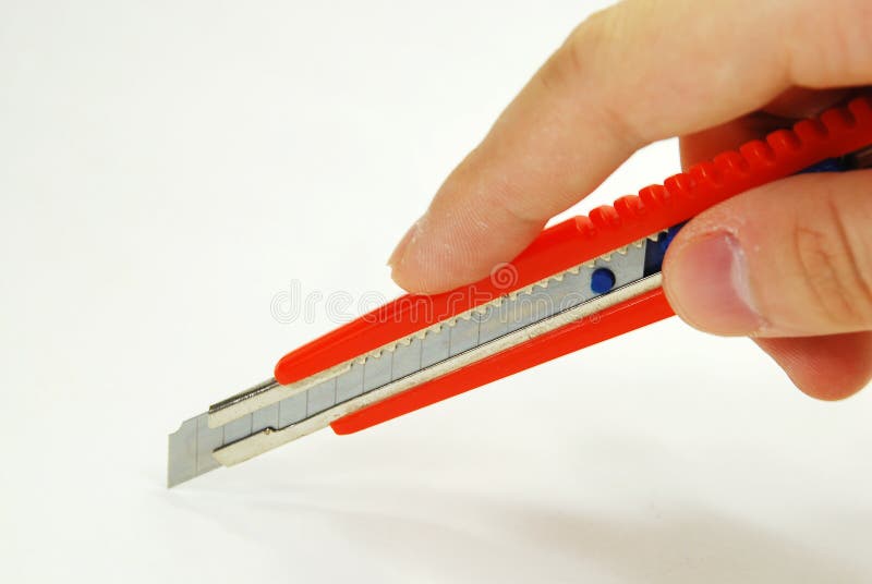 Hand with cutter stock photo. Image of blade, steel, isolated - 10762586