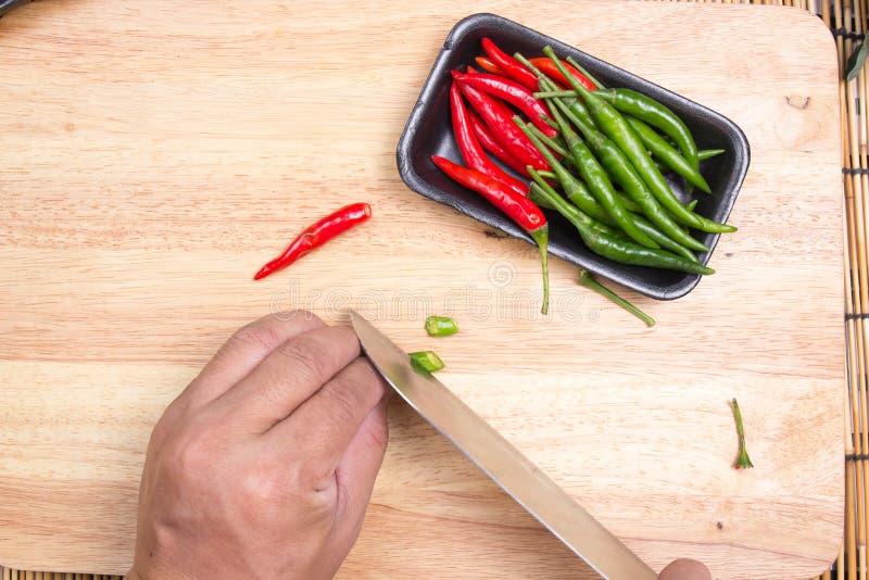 Hand Cutting Hot Chili Peppers Stock Image - Image of food, gourmet ...