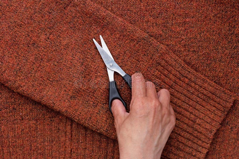 Hand Cutting Lint from Wool Fabric Using Scissors Stock Photo - Image ...