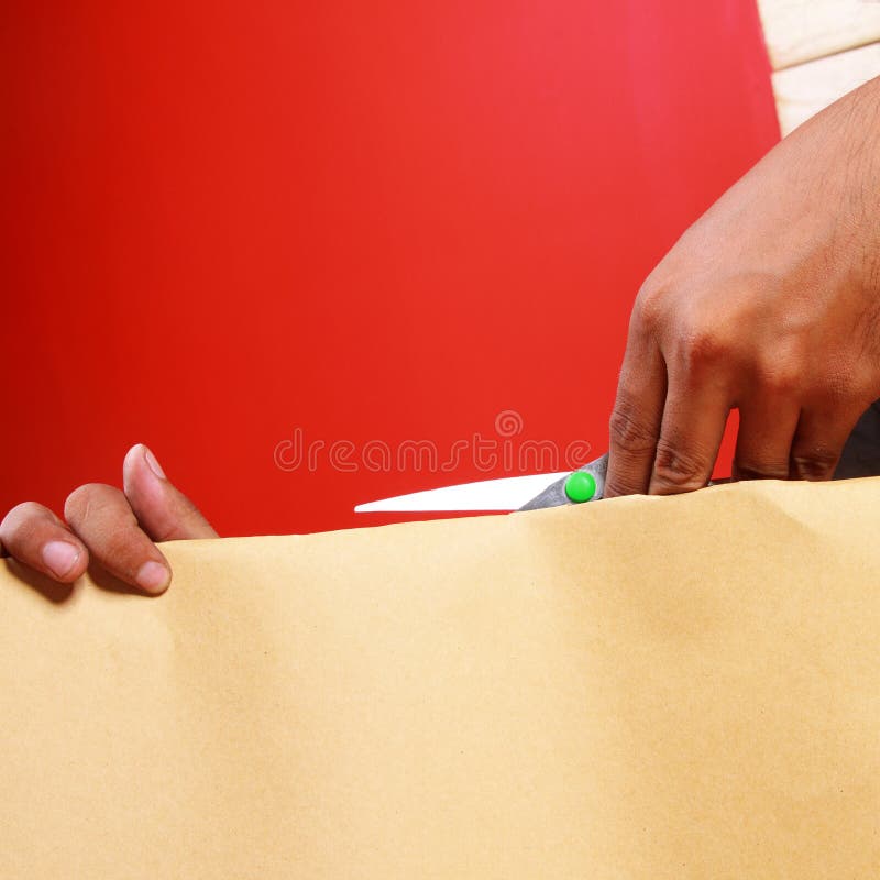 Hand cutting a paper stock image. Image of notes, accessory - 46785451