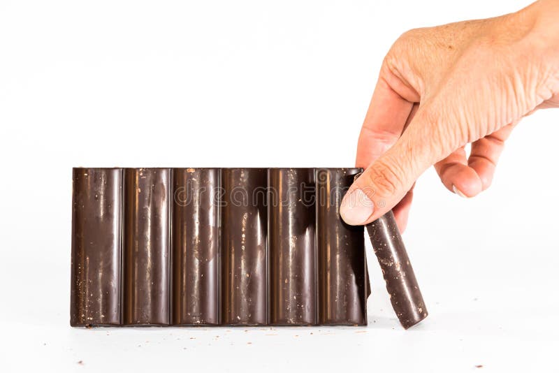 Hand Cutting a Piece of Chocolate from a Bar Stock Photo - Image of ...