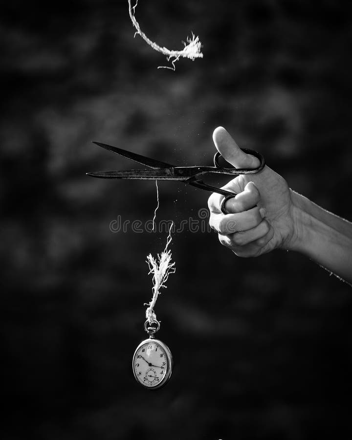 Hand Cutting a Rope with a Clock - Importance of Time Stock Photo ...