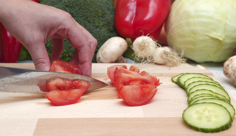 Hand cutting vegetables stock image. Image of chopping - 12875841
