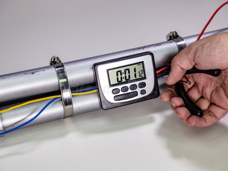 Hand Cutting Wire on Pipe Bomb on White Background Editorial Stock ...