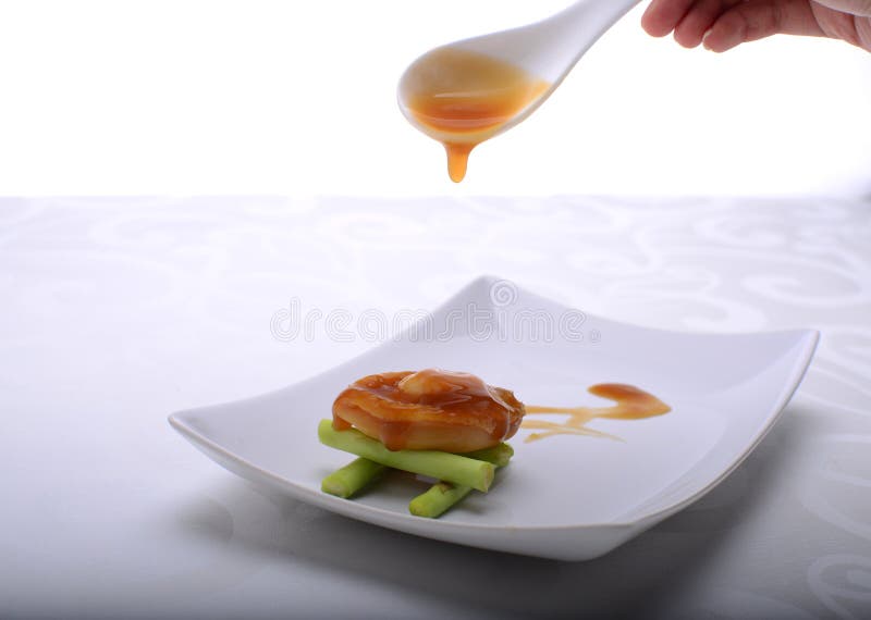 Hand Decorating Abalone in a Photoshoot Where Presentation is Important ...