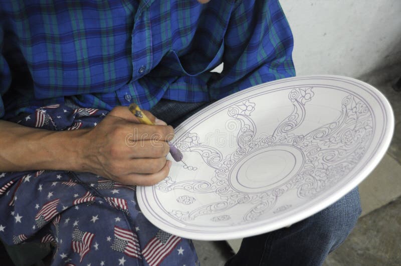 Hand Decorating Ceramic Plate Stock Photo - Image of decorate, tool ...