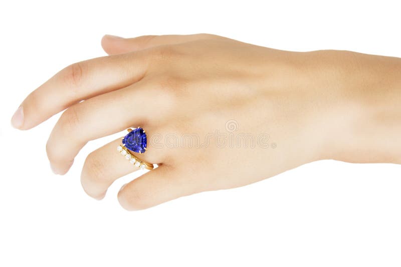 Hand with Designer Ring of Tanzanite, Diamonds and Gold Stock Photo ...