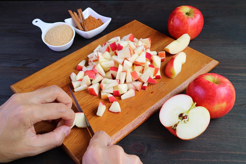 Hand Dicing Fresh Apples on Cutting Board for Making Apple Compote Stock Image - Image of black ...