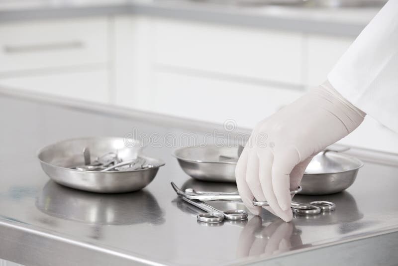 Hand of a Doctor or Pathologist with Medical Instruments Stock Photo ...