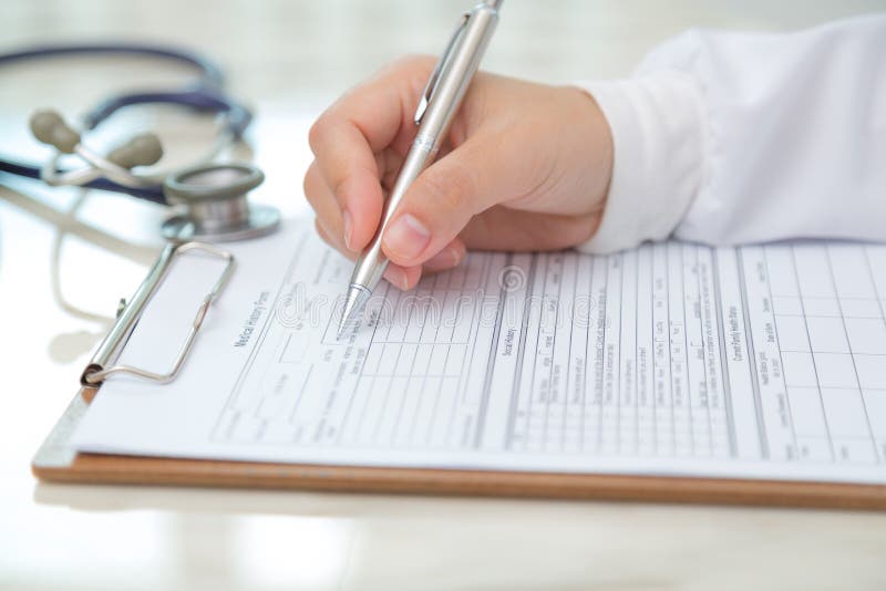 Hand of doctor writing stock photo. Image of application - 55668162