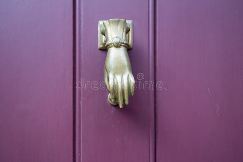 Hand Door Knocker and Purple Door Stock Image - Image of house, door ...