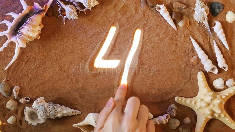 Hand Drawing Number Four 4 Symbol in the Sand. Beach Background Stock ...