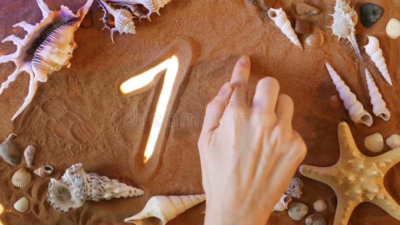 Hand Drawing Yin Yang Symbol in the Sand. Beach Background. Top View ...