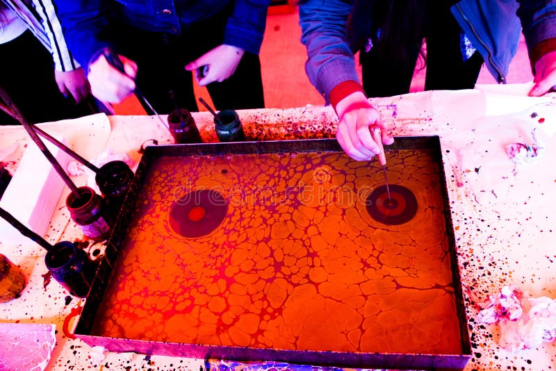 Hand Drawing with Stick Stained Inks on Water Stock Photo - Image of ...