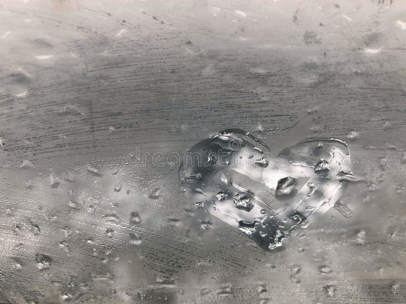 Hand Drawn Heart Shape on a Window Pane with Rain Drops Stock Photo ...