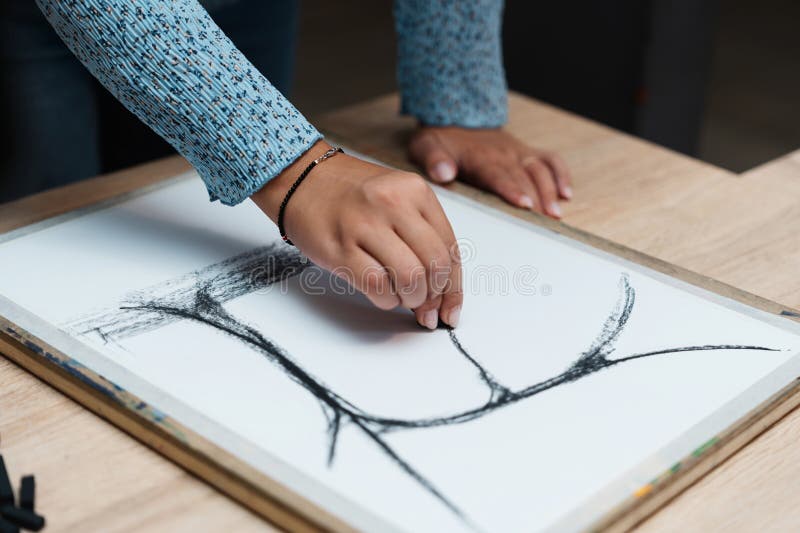 Person Sketching Abstract Lines on Paper with Charcoal in a Creative ...