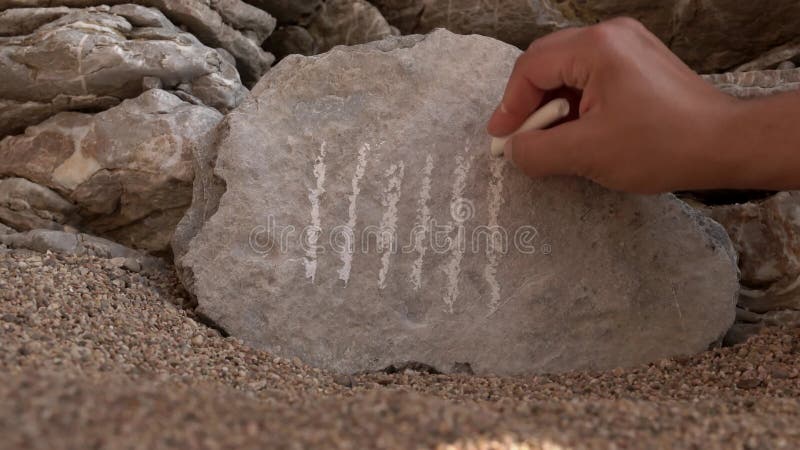 Hand Carefully Draws with Chalk Vertical White Lines on Stone Counting ...