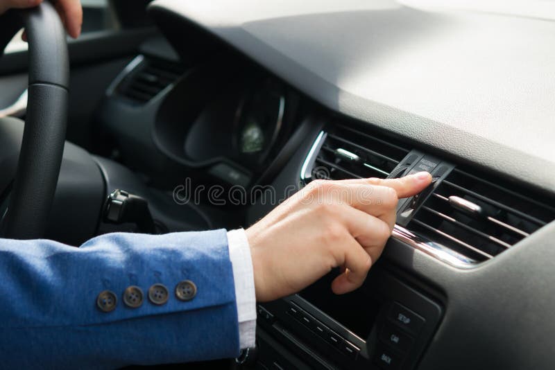 The Hand of the Driver of the Car Opens the Air Intake on the Car Stock ...