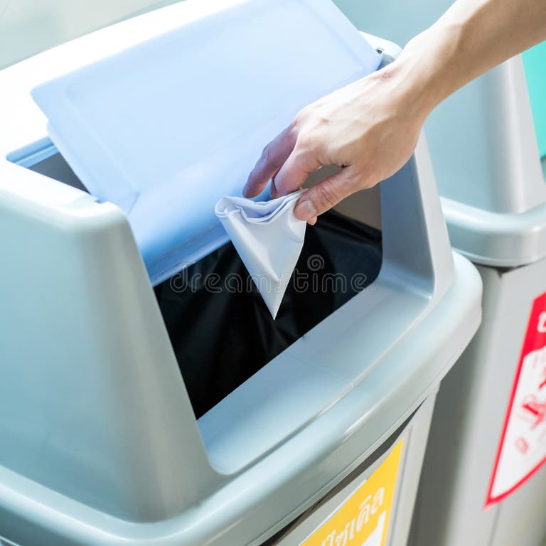 Hand Dropping Crumpled Paper Stock Image - Image of discard, waste ...