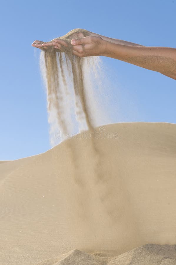 Hand Dropping Sand with Blue Sky Stock Photo - Image of beauty, grain ...