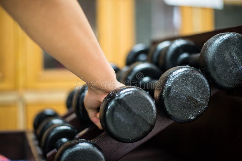 Hand with Dumbbells in Gym Concept Stock Photo - Image of active ...