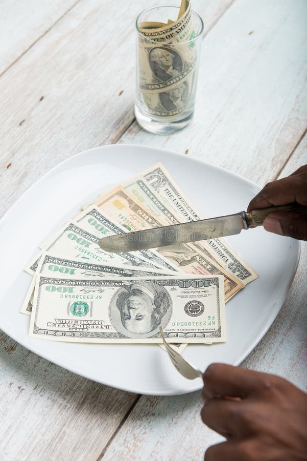Hand Eating Banknotes Symbolising Consumerism Stock Image - Image of ...